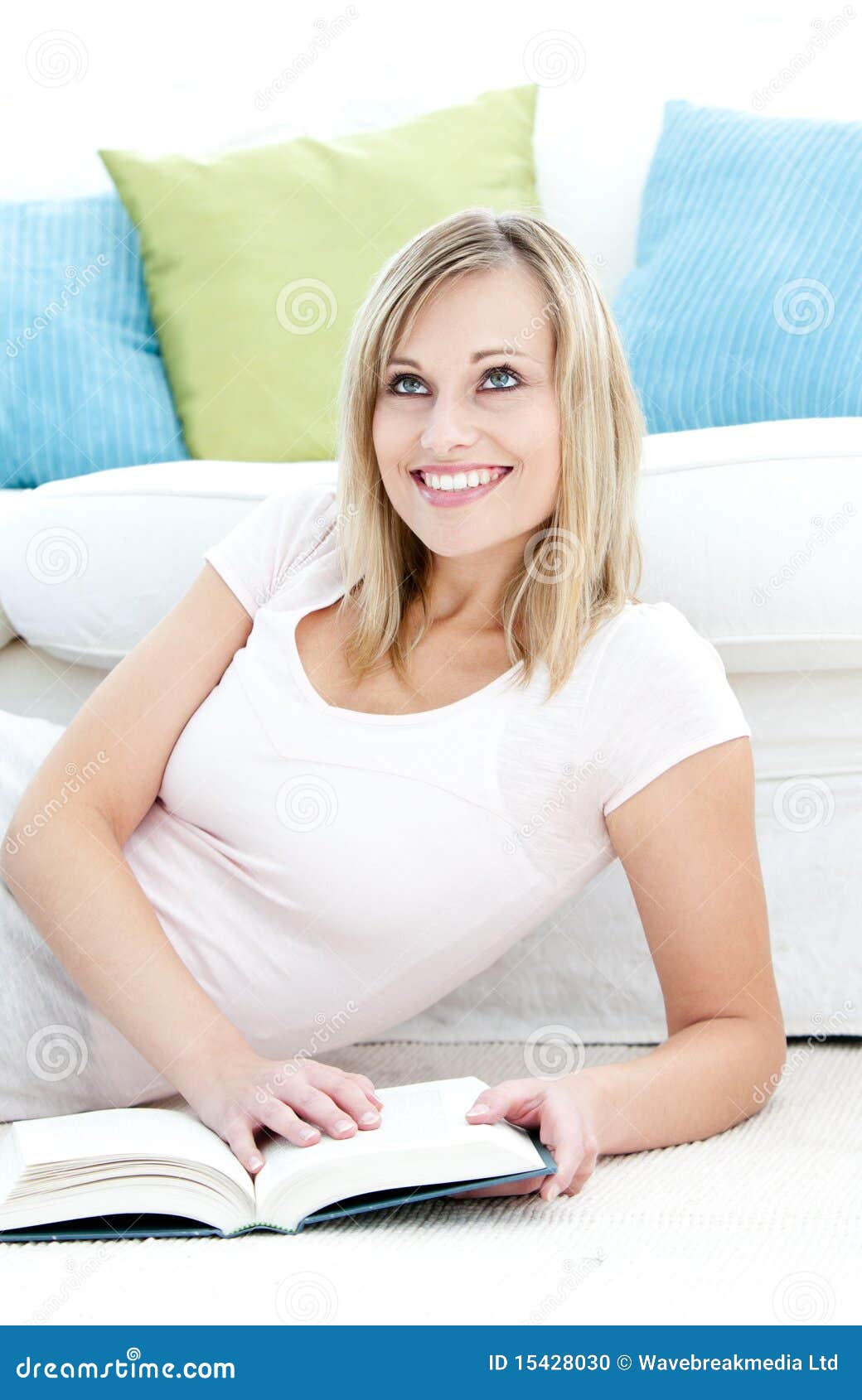 Glowing Young Woman Reading a Book on the Floor Stock Photo - Image of ...