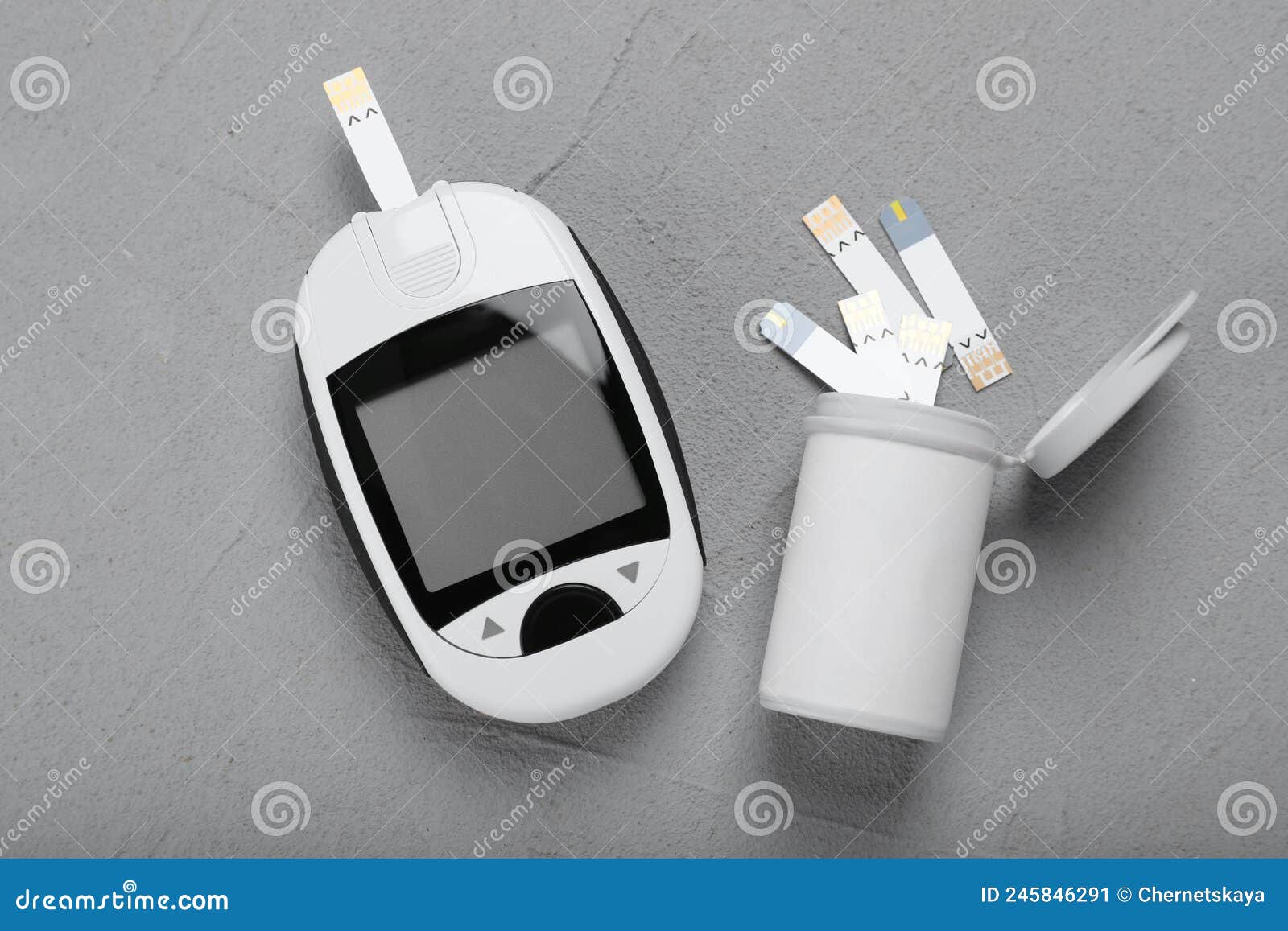 Glucometer And Bottle With Strips On Grey Table, Flat Lay. Diabetes ...