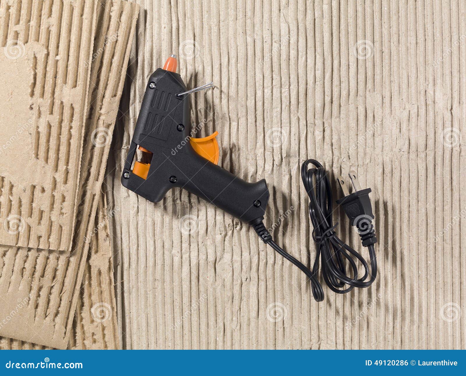 Glue gun and cardboard stock photo. Image of fibre, corrugated - 49120286