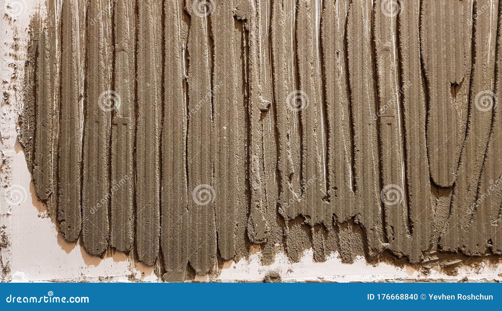 Glue for a Tile with a Gear Pattern. Installation of Tiles Stock Photo ...