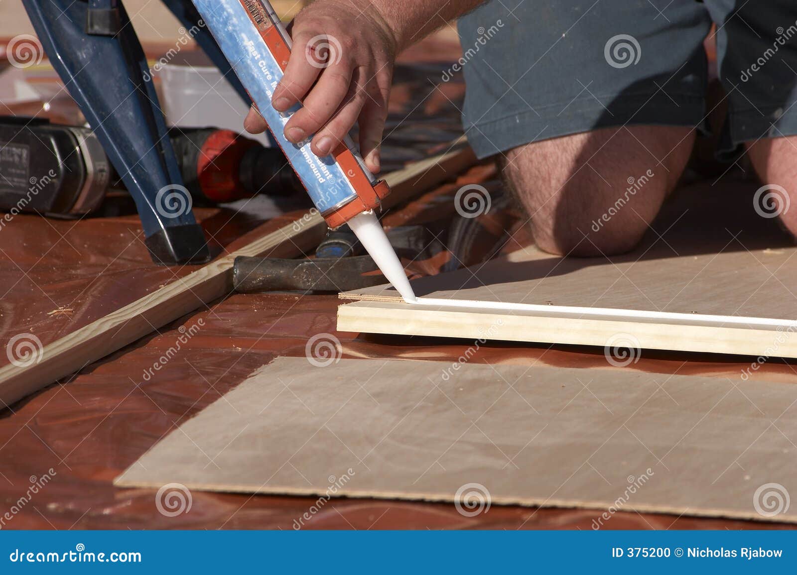 Glueing stock photo. Image of shorts, line, kneeling, holding - 375200
