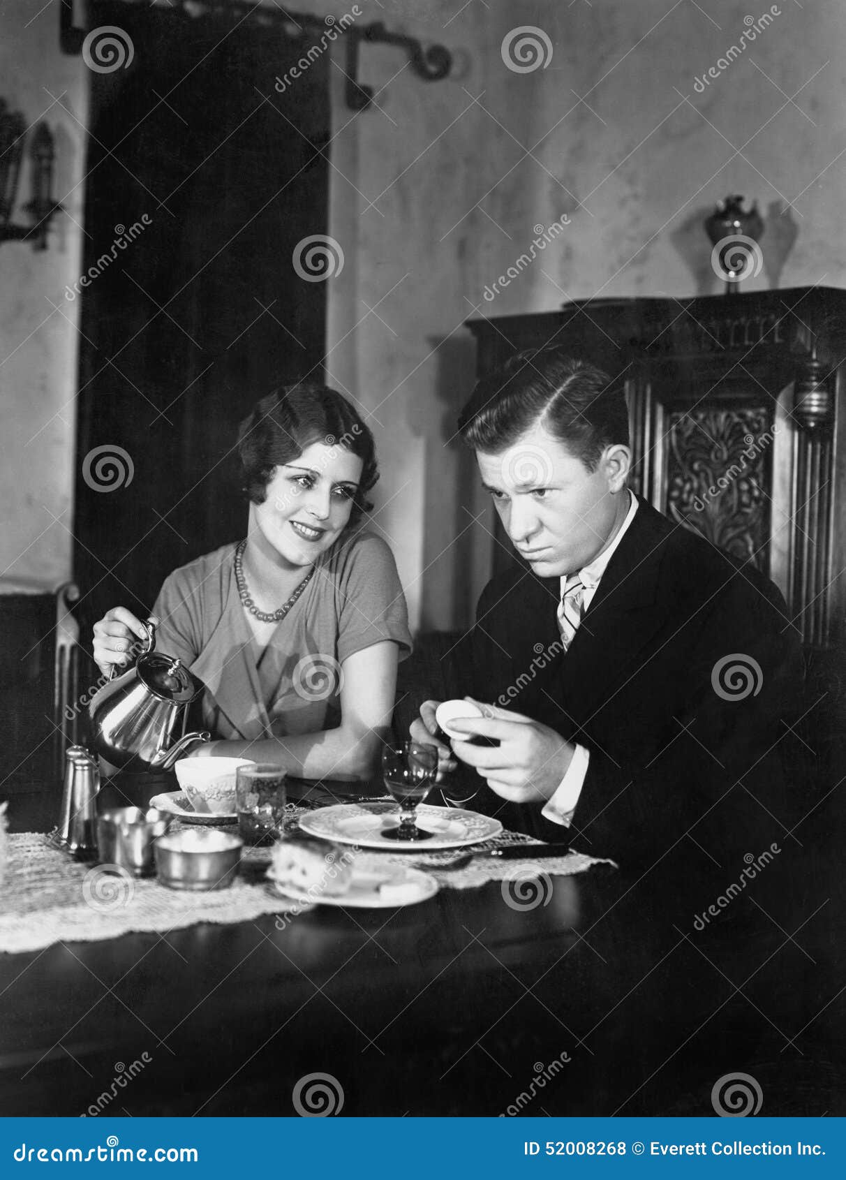 Glum Man and Adoring Woman at Breakfast Table Stock Photo - Image of ...
