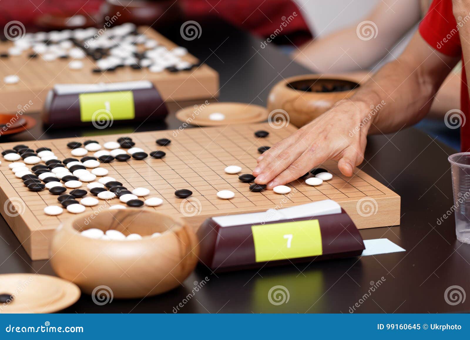 Playing go stock image. Image of indoors, people, player - 99160645