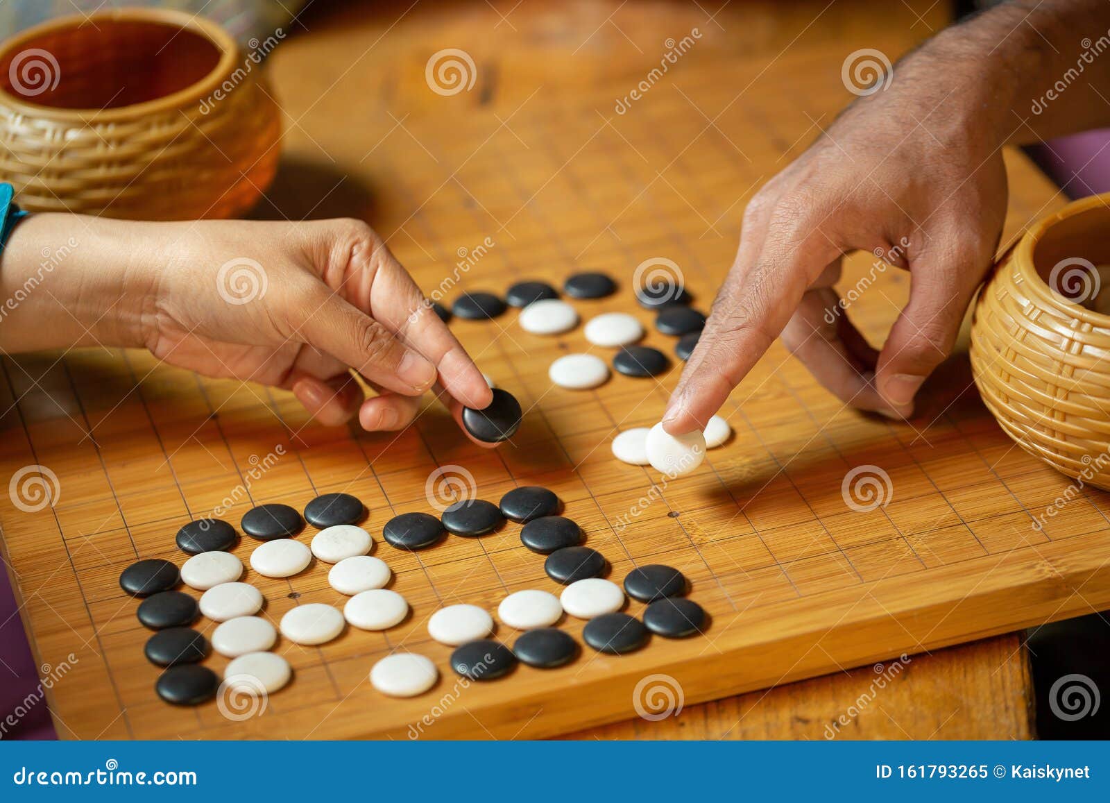 Go Board Game Playing. a Competitor is Placing a Marble Piece on a Go ...