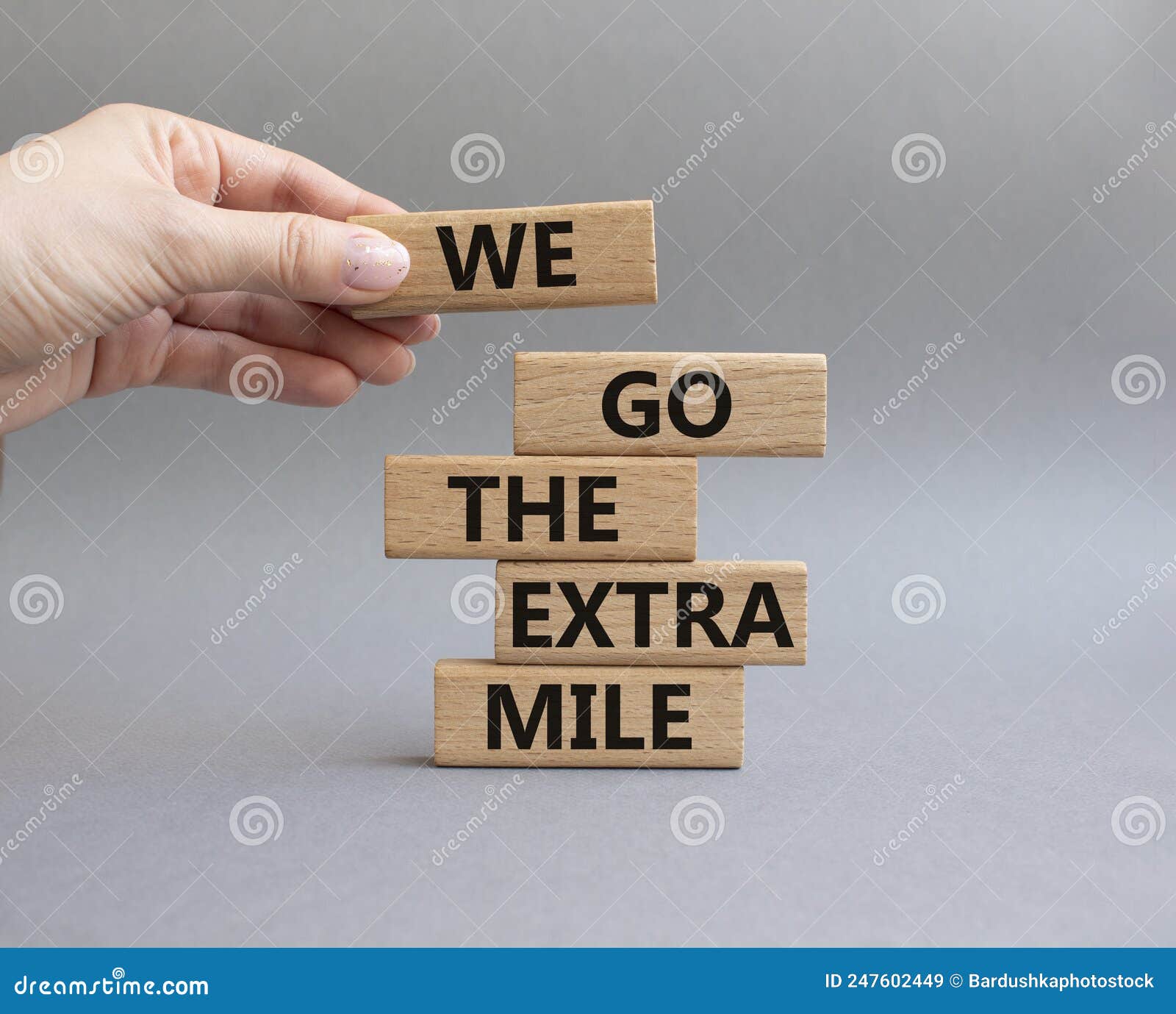 We Go the Extra Mile Symbol. Wooden Blocks with Words we Go the Extra ... We Go the Extra Mile Symbol. Wooden Blocks with Words we Go the Extra ...