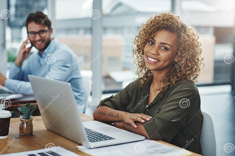Go Getters Get it Done. Portrait of a Young Woman Working at Her Desk ... Go Getters Get it Done. Portrait of a Young Woman Working at Her Desk ...