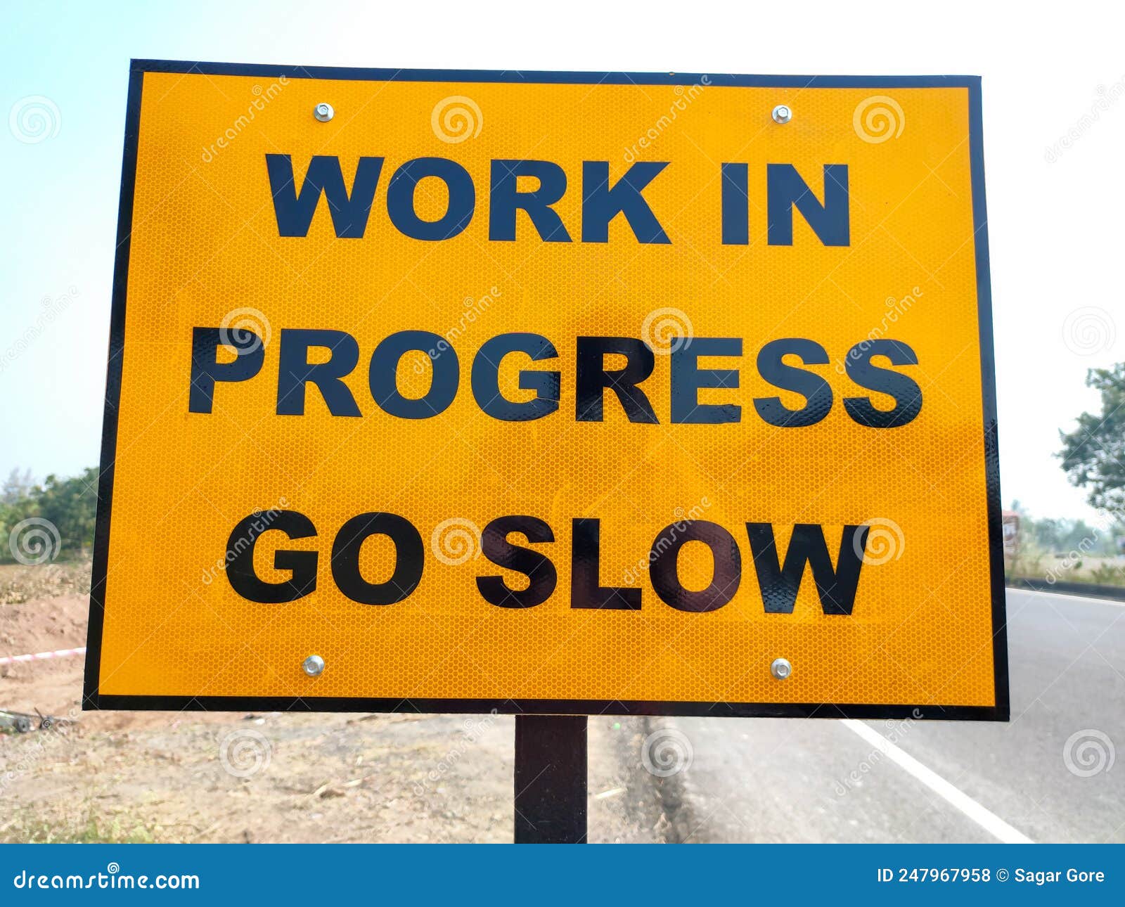 Go Slow Work in Progress Sign Board beside Roads Stock Photo - Image of ...