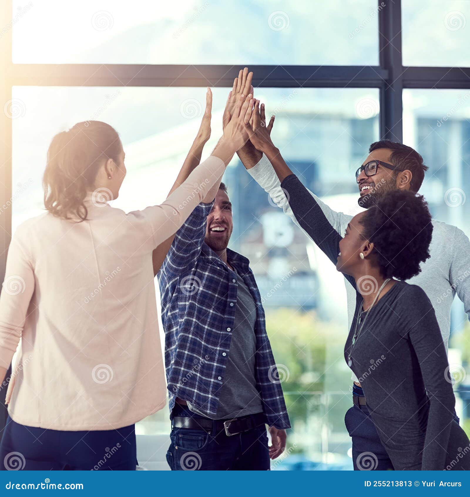 Go Team. a Group of People High Fiving in the Office. Stock Image ...