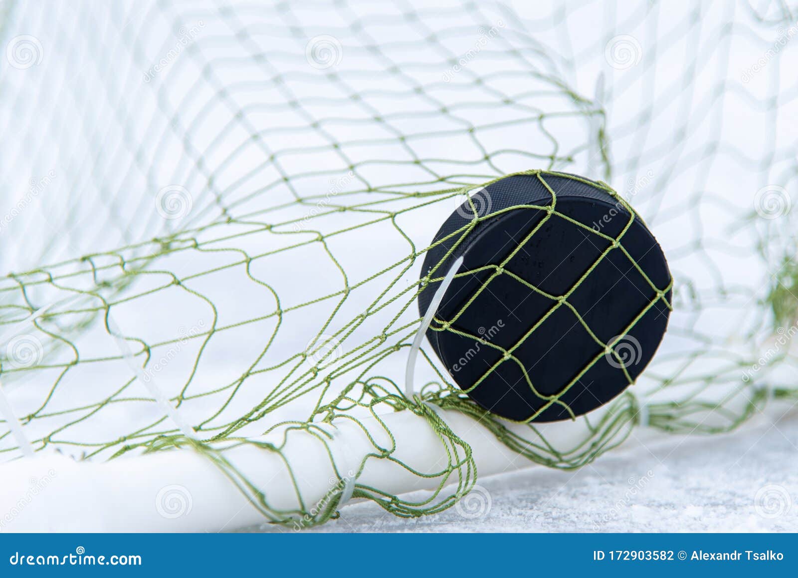 Goal Scored by a Hockey Puck in the Goal Net Stock Photo - Image of ...