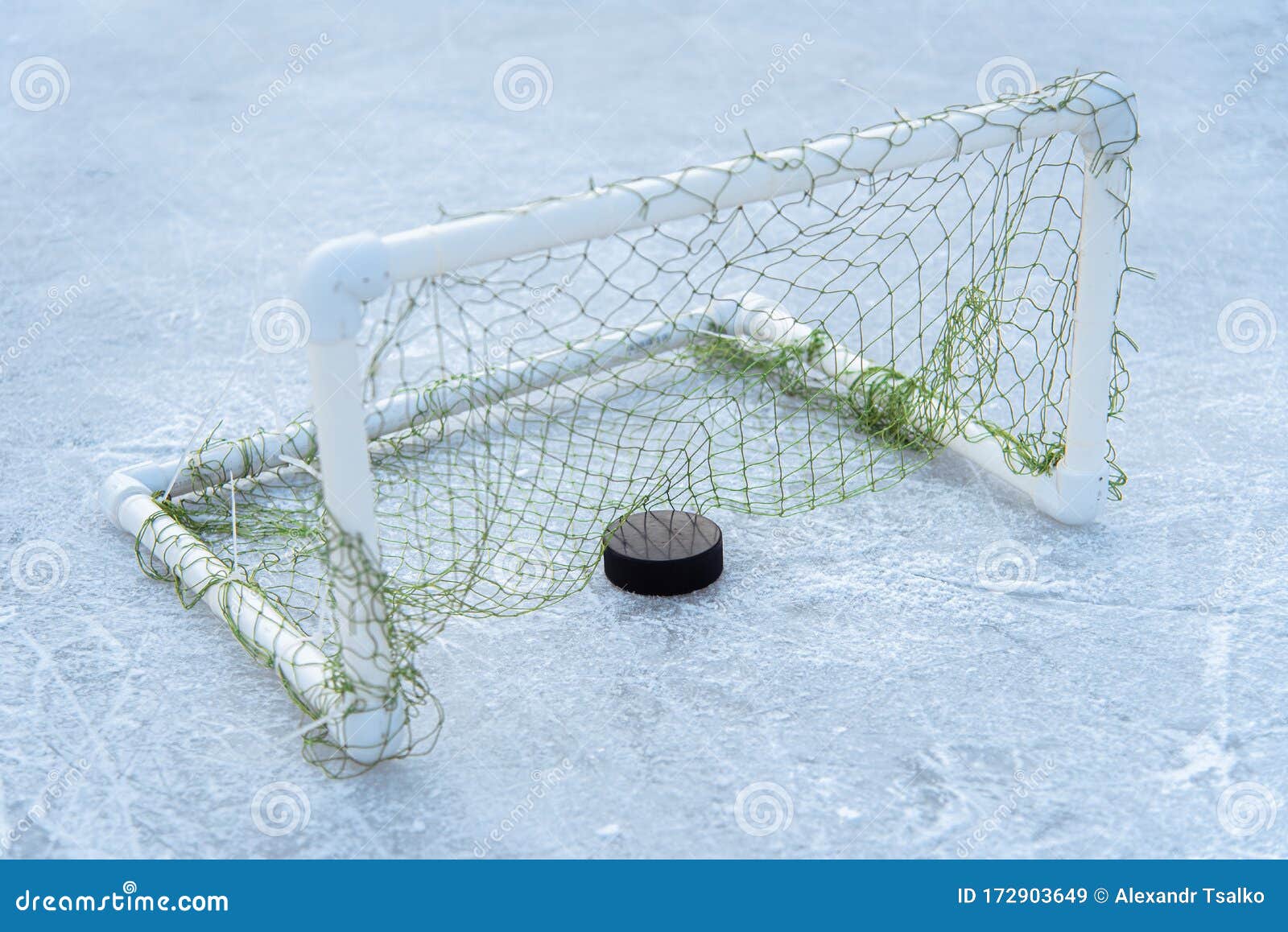 Goal Scored by a Hockey Puck in the Goal Net Stock Image - Image of ...