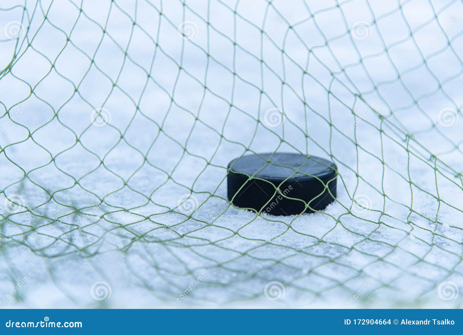 Goal Scored by a Hockey Puck in the Goal Net Stock Photo - Image of ...