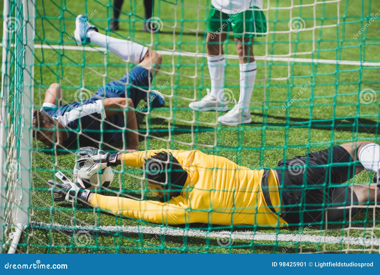 Goalkeeper Catching Ball during Soccer Game on Pitch Stock Image ...