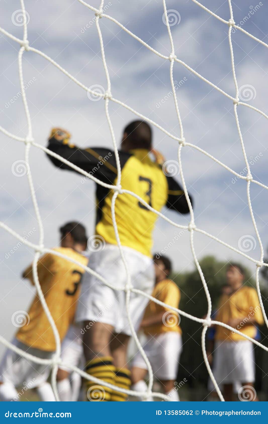 Goalkeeper Jumping for Soccer Ball Stock Photo - Image of yellow ...