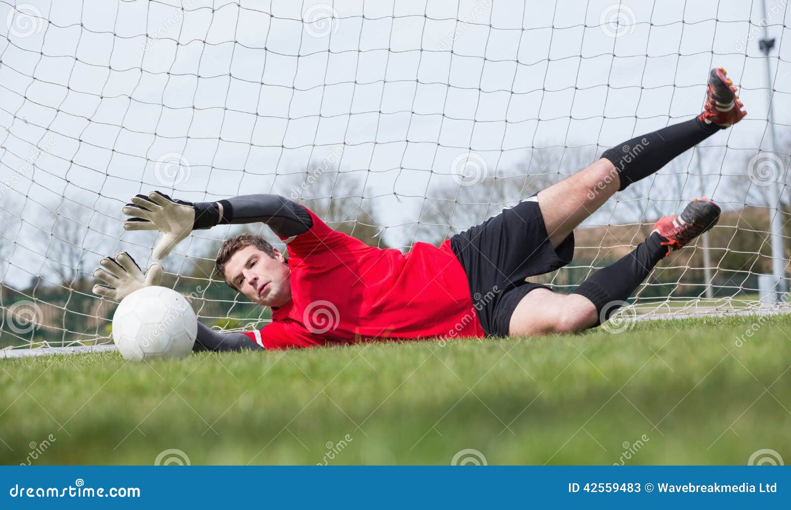 Goalkeeper in Red Saving a Goal during a Game Stock Image - Image of ...