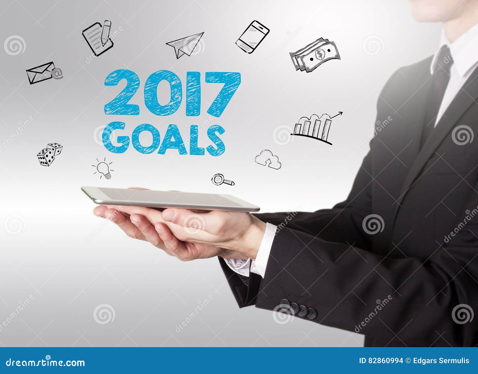 2017 Goals Concept, Young Man Holding a Tablet Computer Stock Photo ...