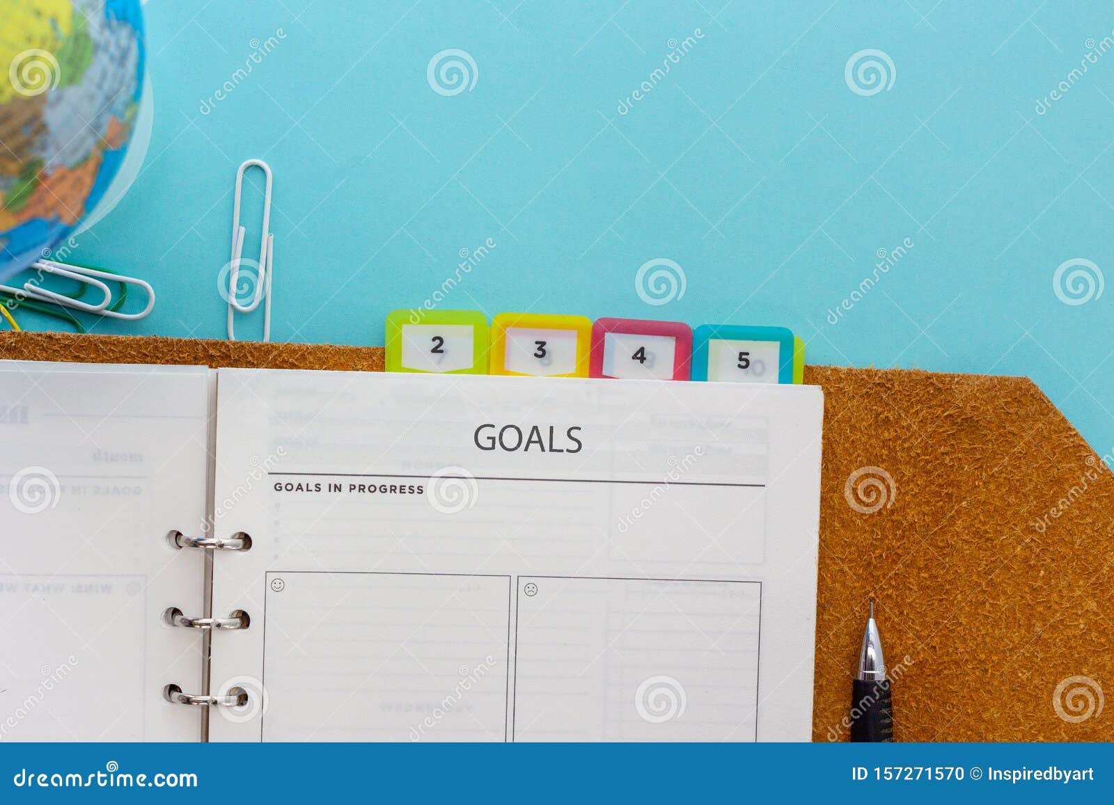 Goals Setting on Planner with Mechanical Pencil on Blue Background ...