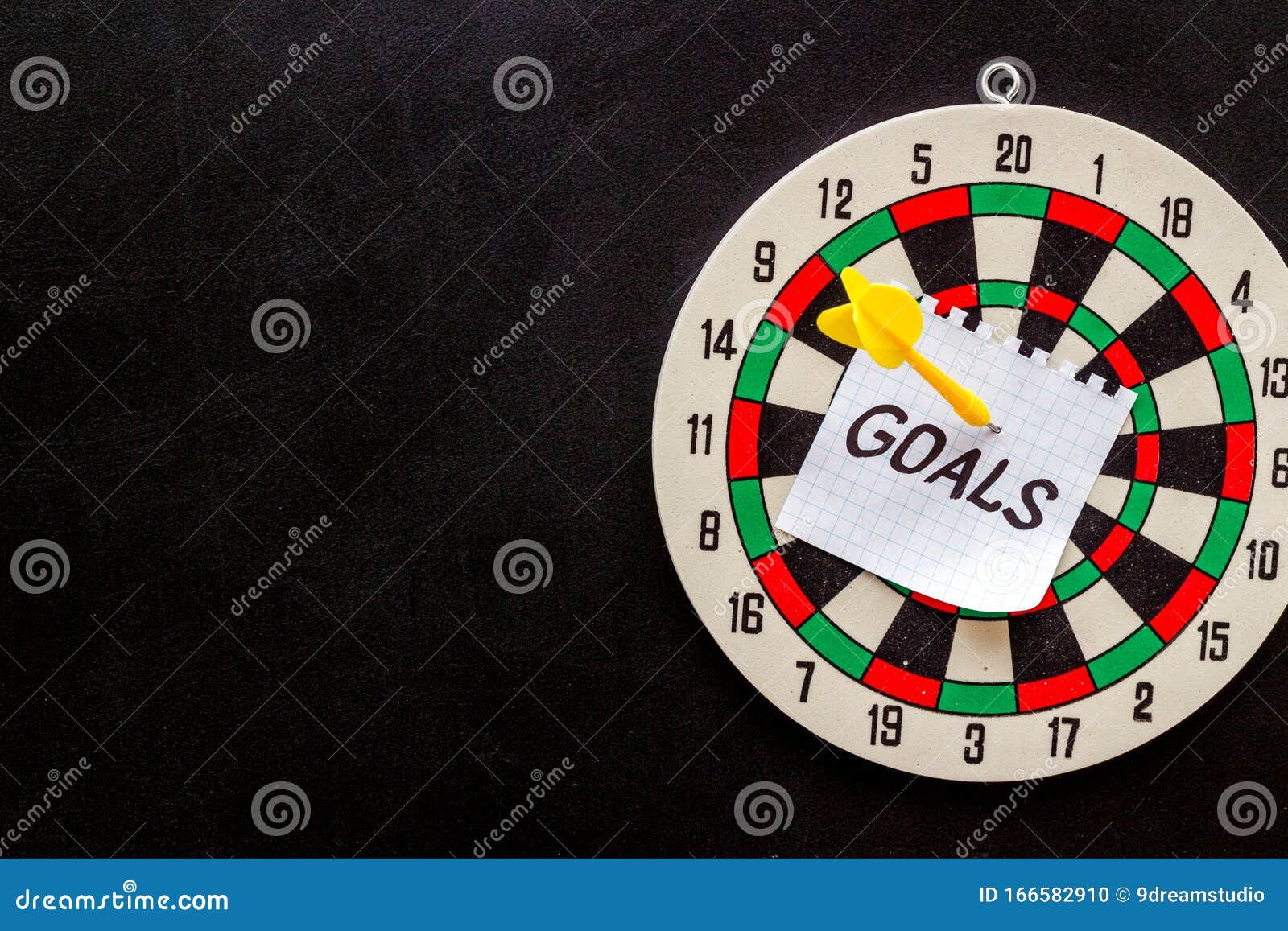 Goals Text Attached by Dart To Dart Board on Black Background Top-down ...