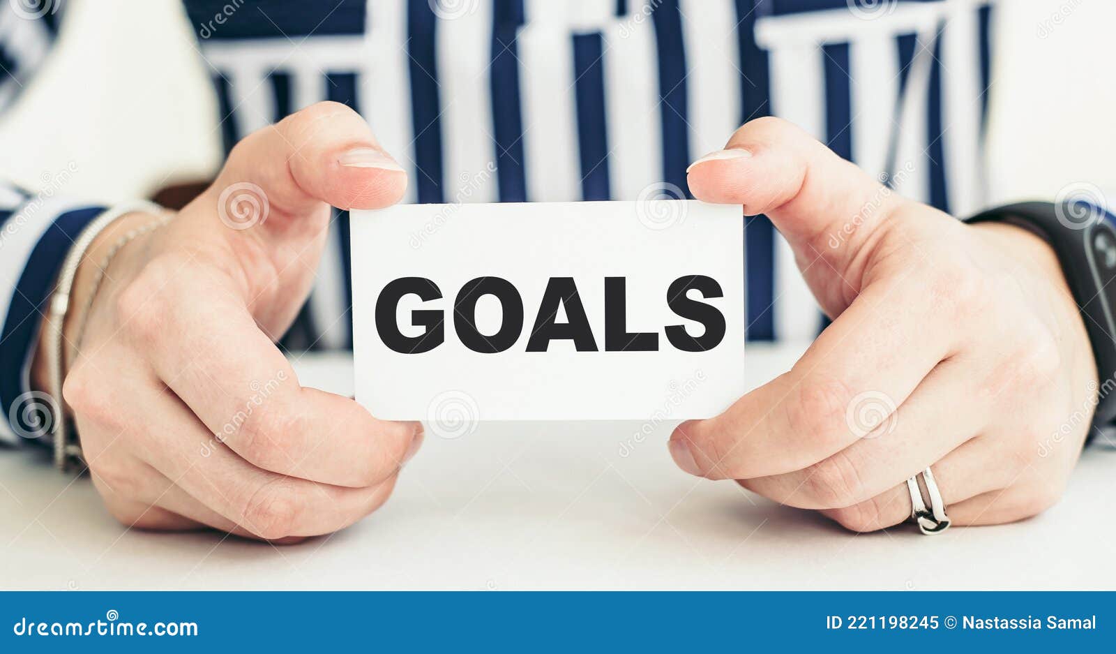 GOALS. Woman Holding a Card with a Message Text Written on it Stock ...