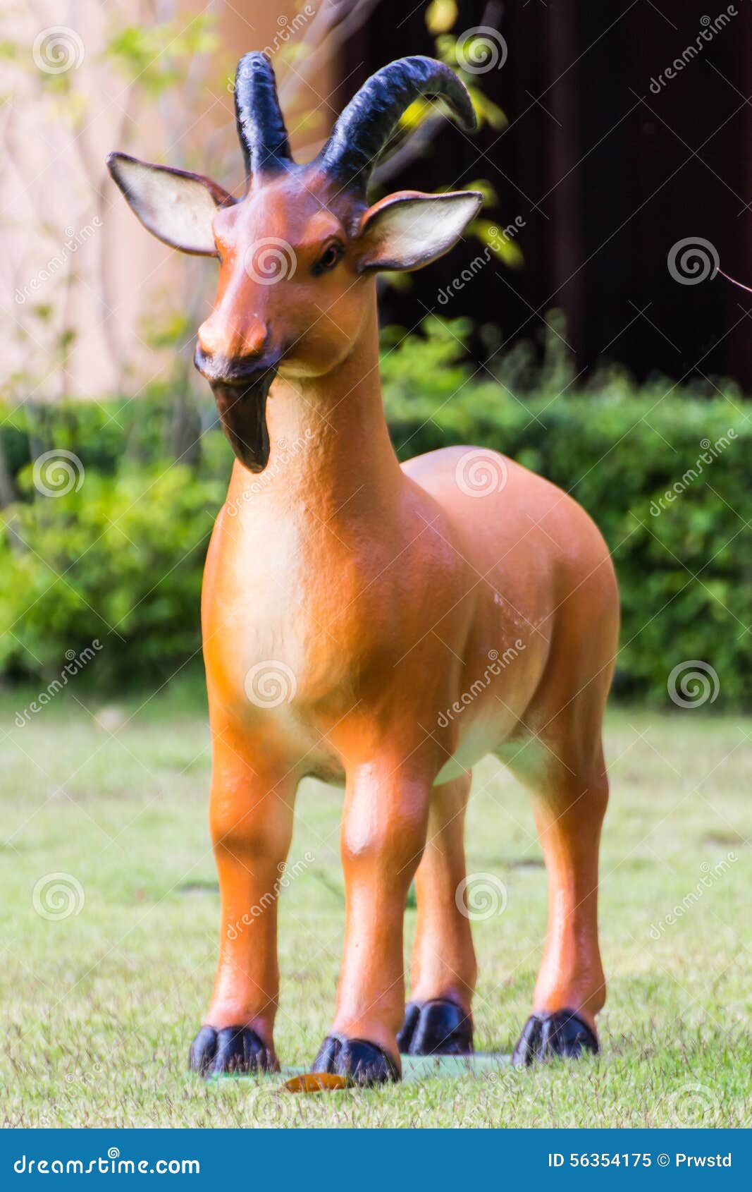 Goat statue in lawn stock image. Image of area, ornament - 56354175