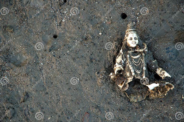 God Statue in the Mud India Stock Photo - Image of culture, flowers ...