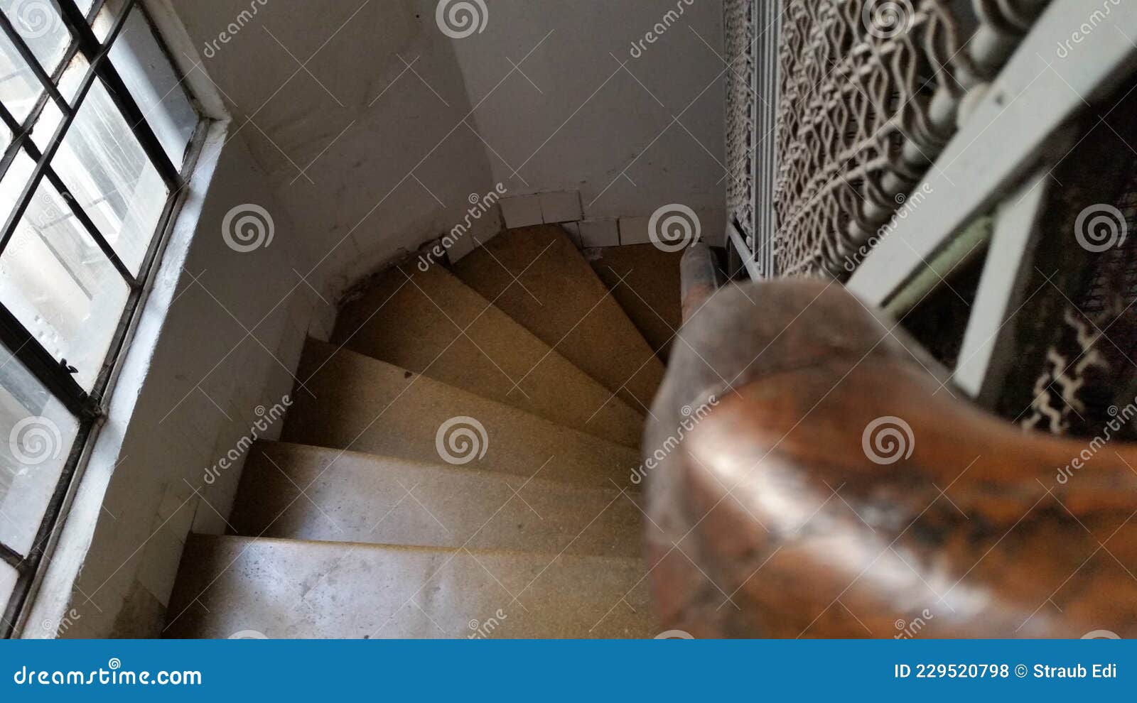 Going down the stairs stock photo. Image of lowlight - 229520798