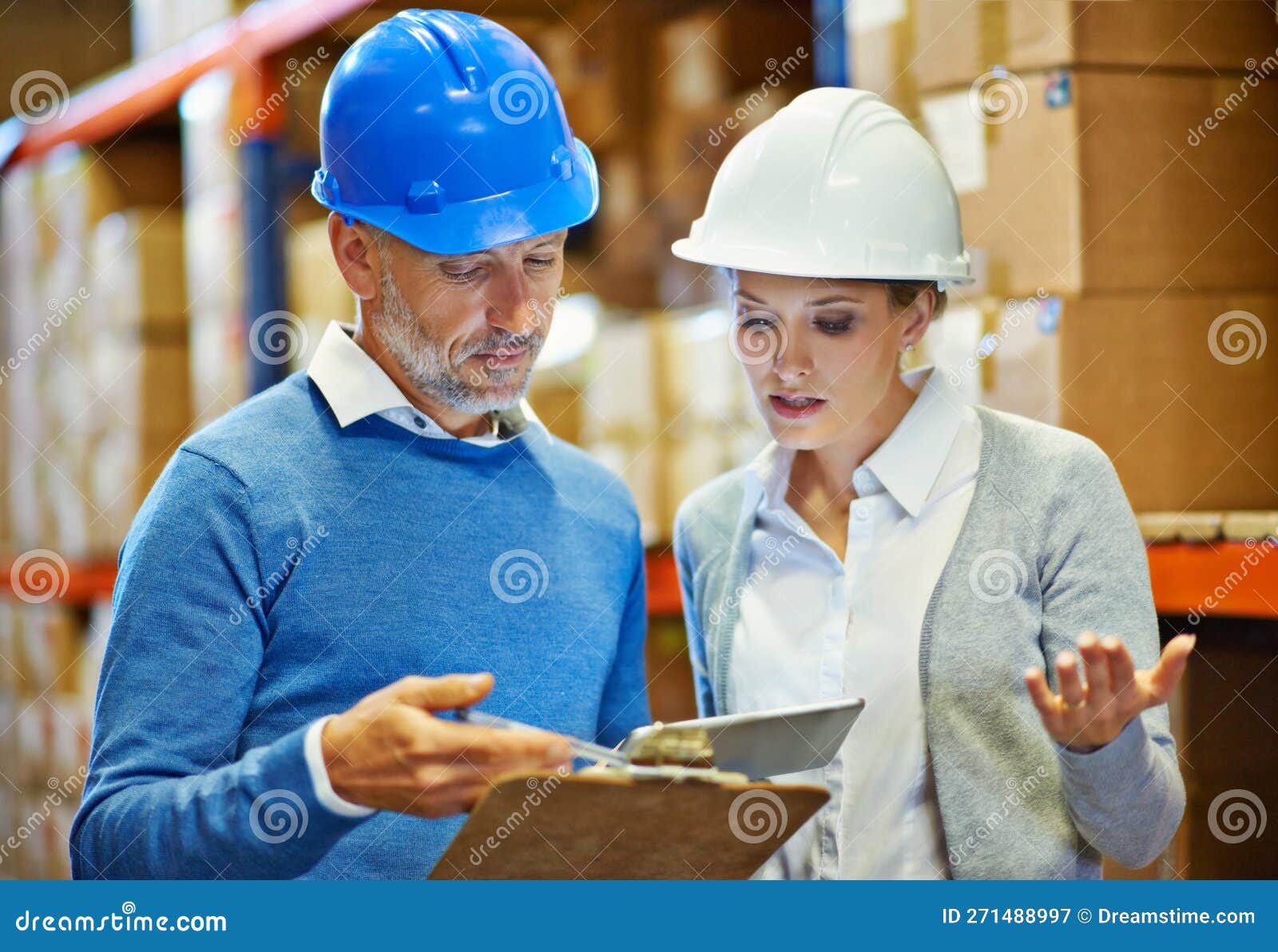 Going Over the Discrepancies in Their Figures. Two People Doing an ...