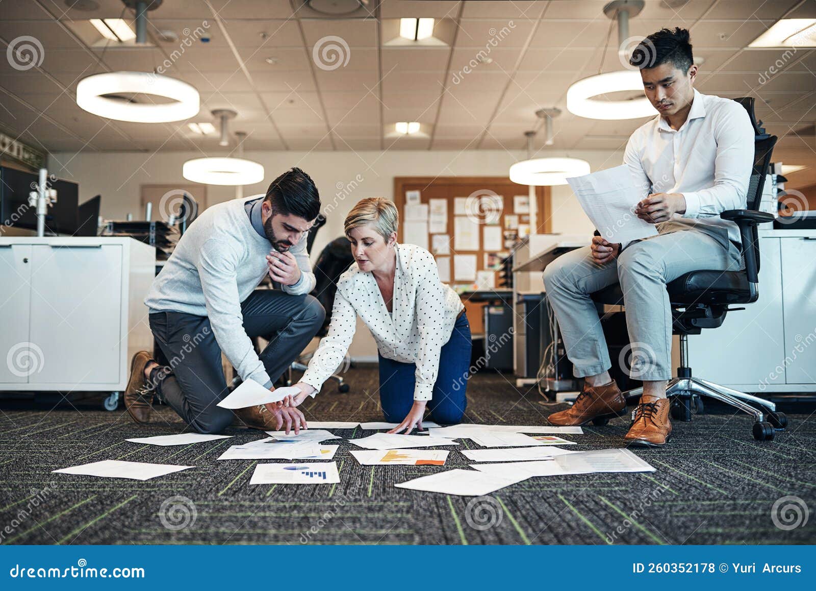 Going through the Paperwork Together. Businesspeople Working on ...