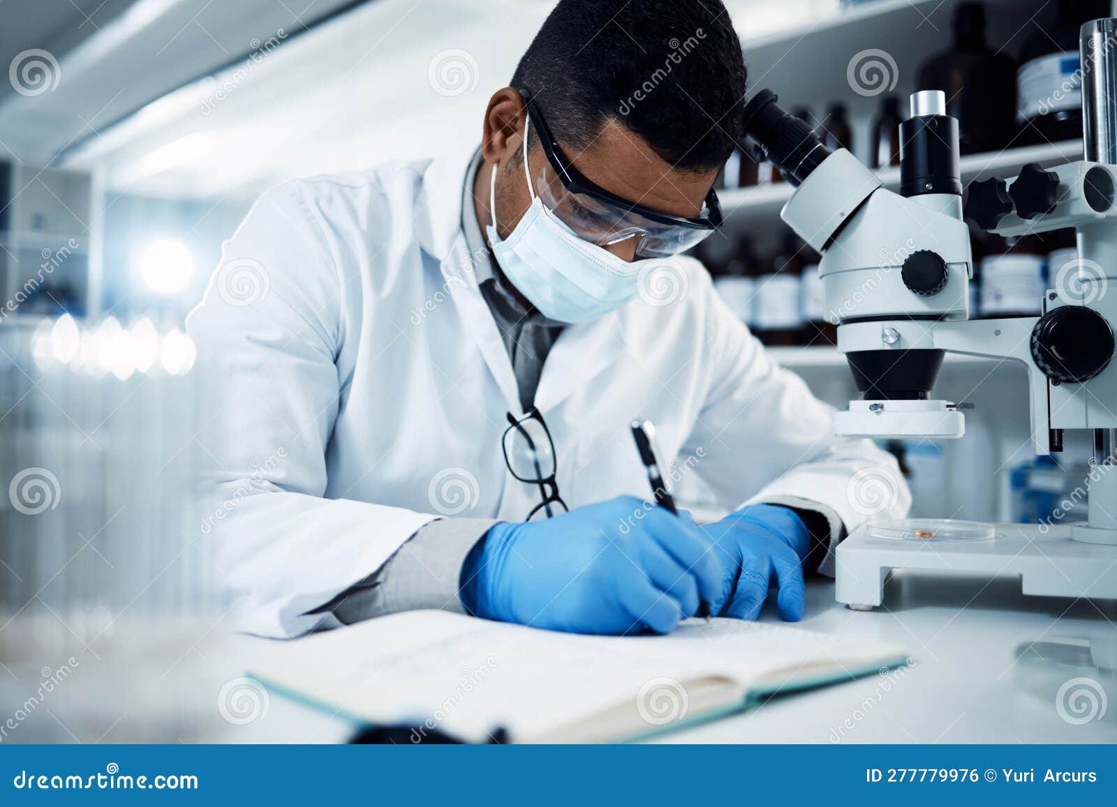 This is Going To Change Everything. a Young Scientist Writing Notes ...