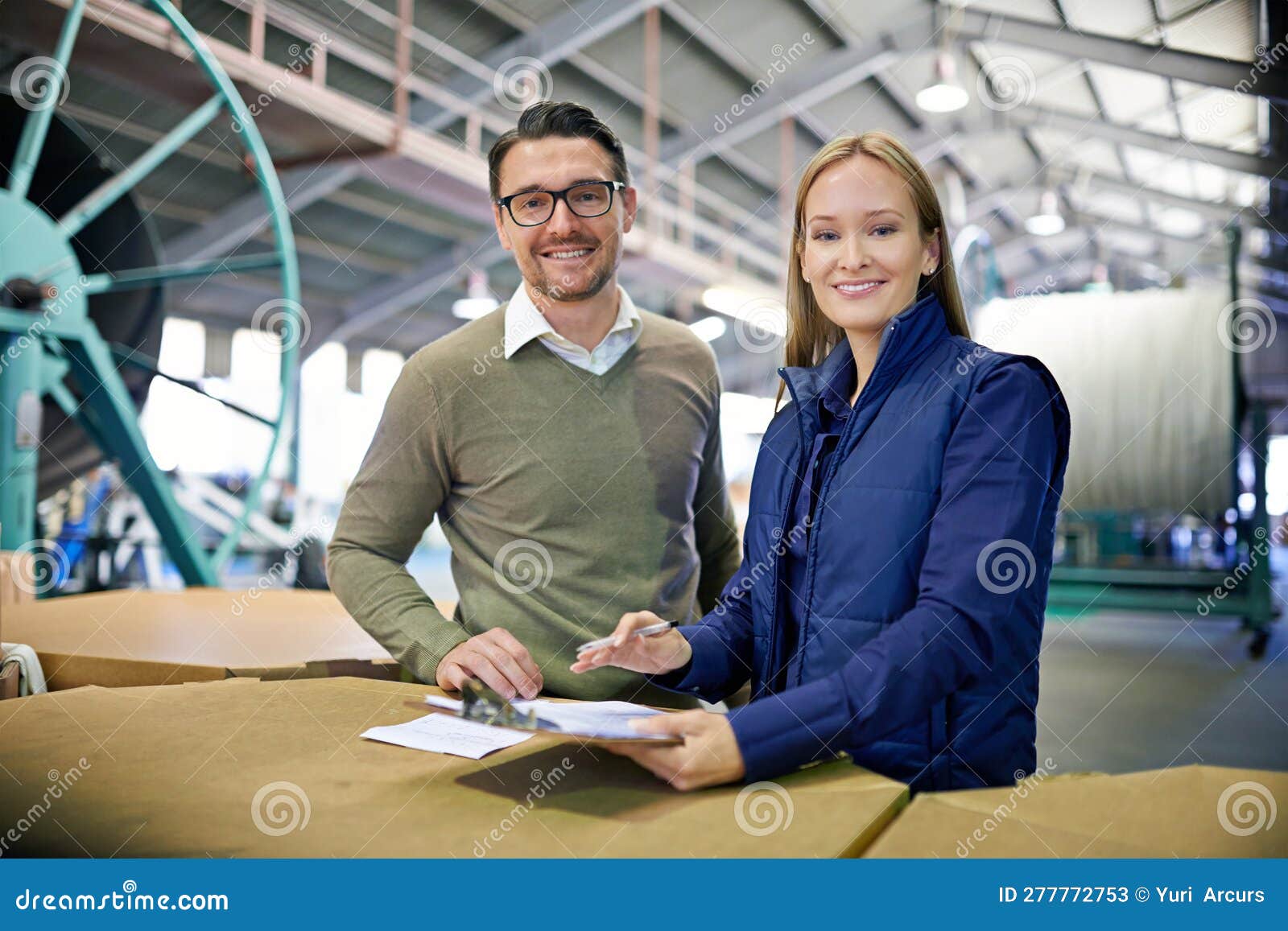 Going through Your Orders. a Two Coworkers Managing a Warehouse. Stock ...