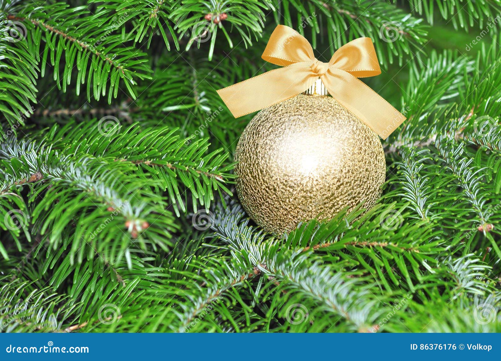 Gold Ball Shape Christmas Decoration on Tree with Bow Stock Photo ...