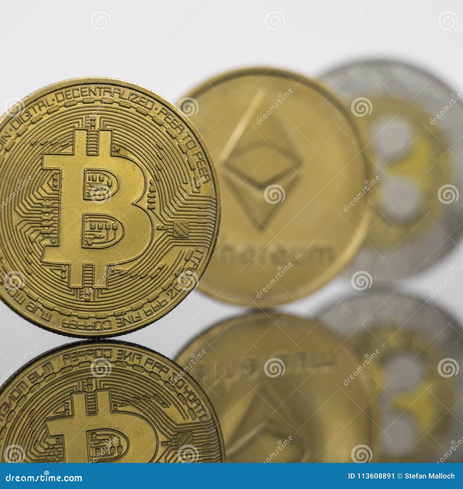 Gold Bitcoin, Etherium and Ripple Tokens in a Row Editorial Photo ...
