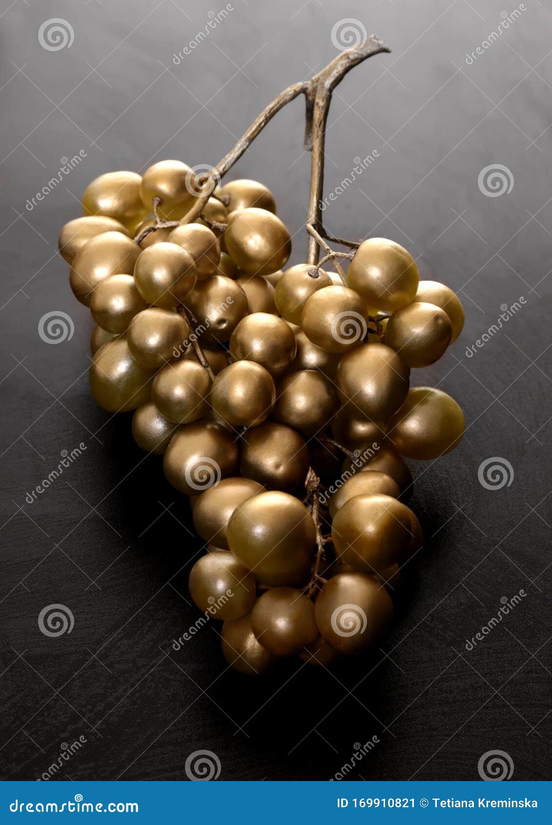 Gold Brunch of Grape on Black Background. Golden Fruit Stock Image ...