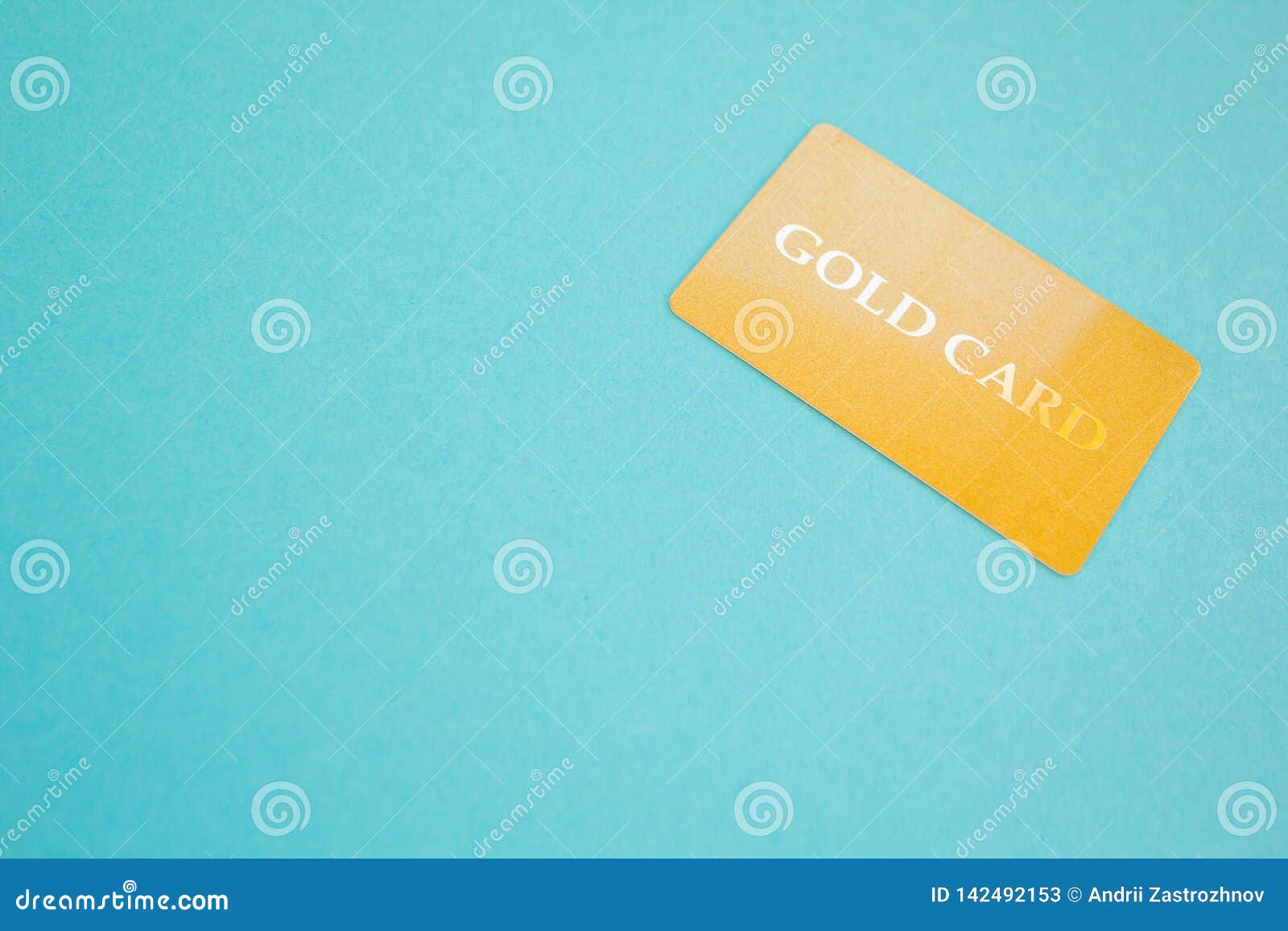 Gold Card on a Blue Background, Concept. Space for Text Stock Image ...