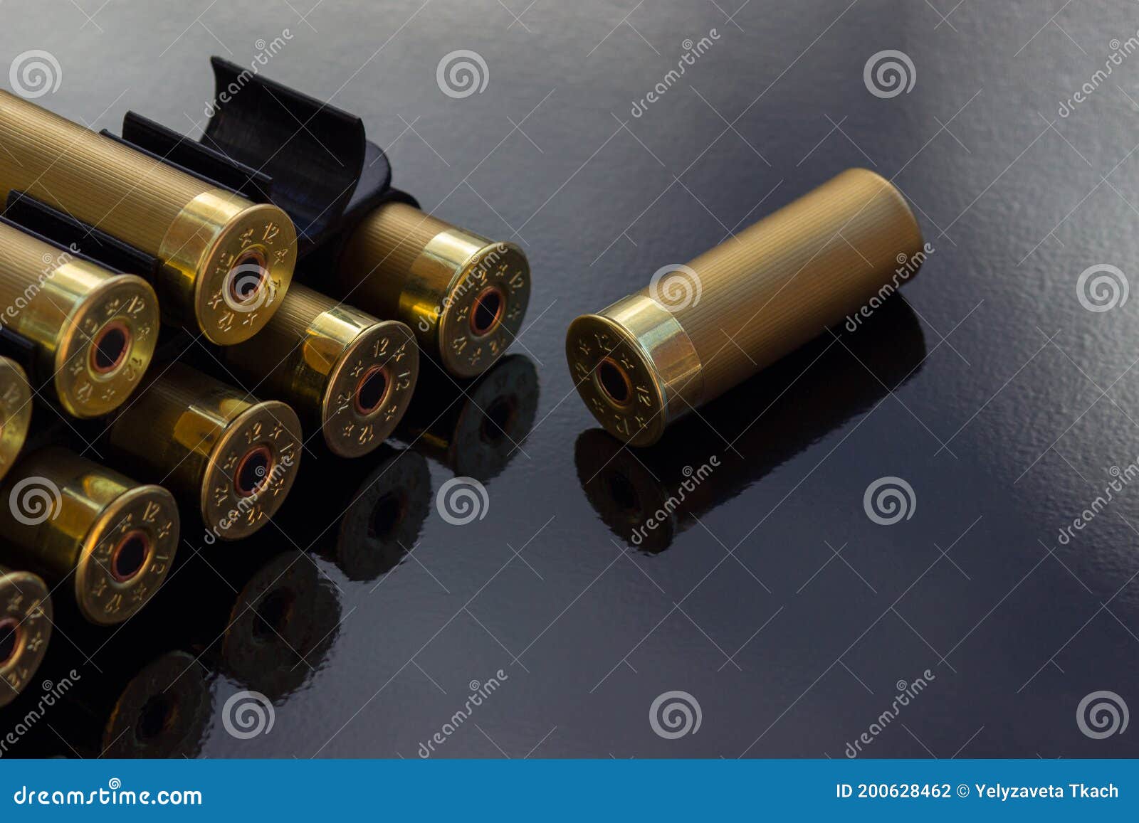 Gold Cartridges on the Black Glossy Background Stock Photo - Image of ...