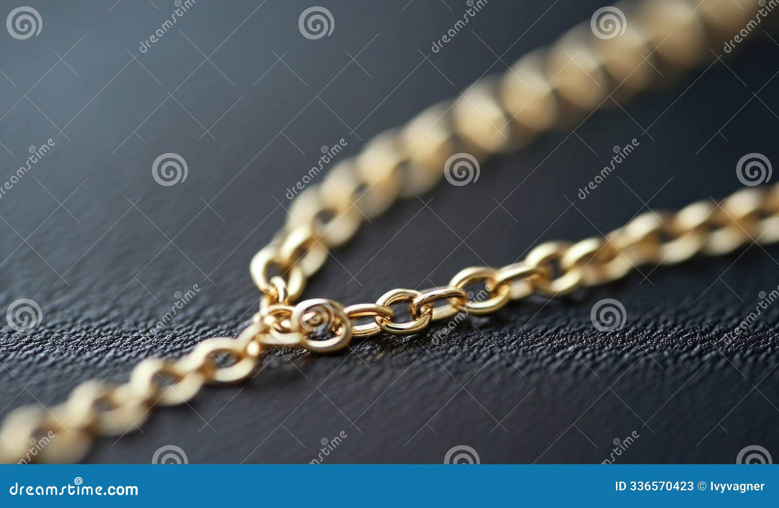 A Gold Chain with a Clasp is Shown on a Black Surface Stock ...