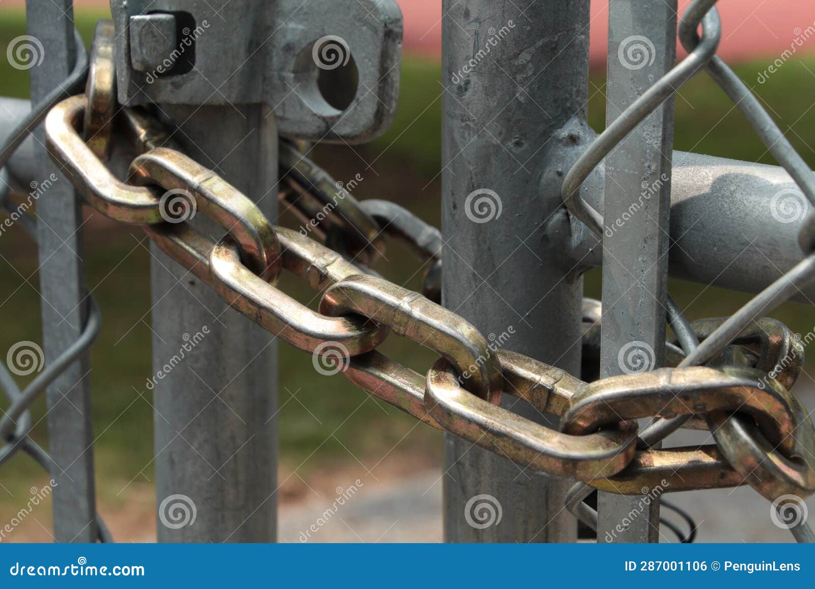 Gold Chain Link Locking a Silver Gated Fence Shut, Close Up. P Stock ...