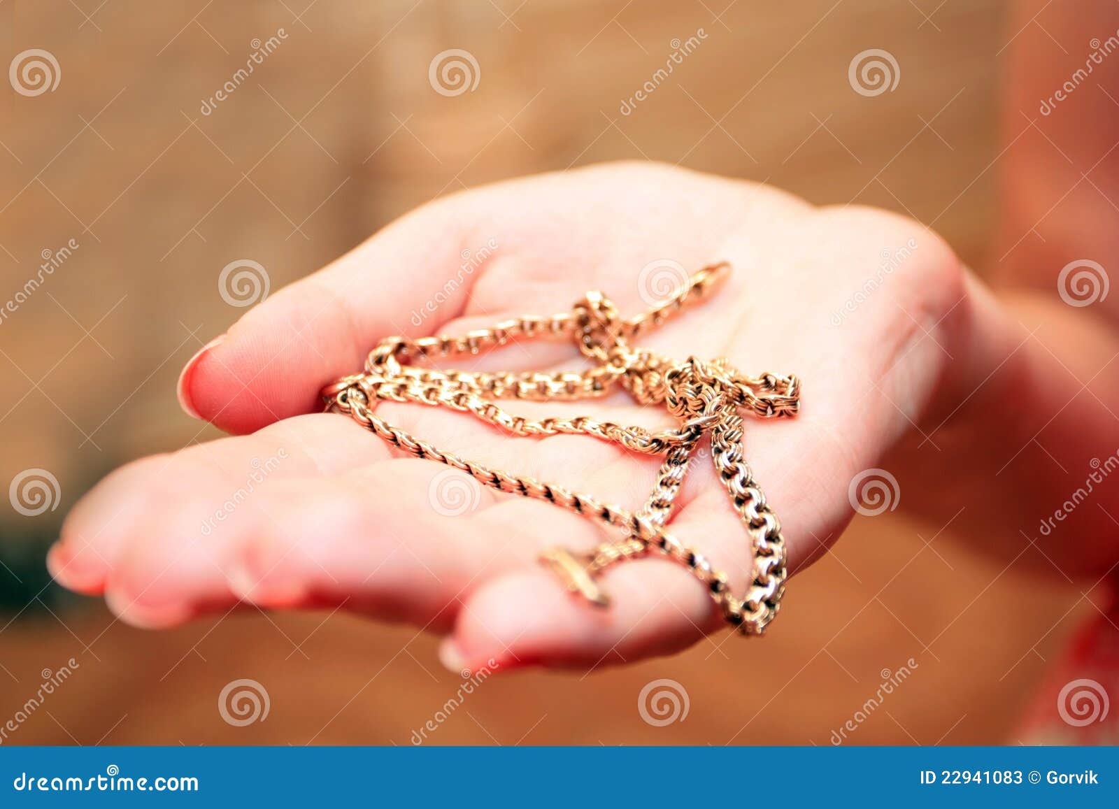Gold chain on a palm stock image. Image of prompt, value - 22941083