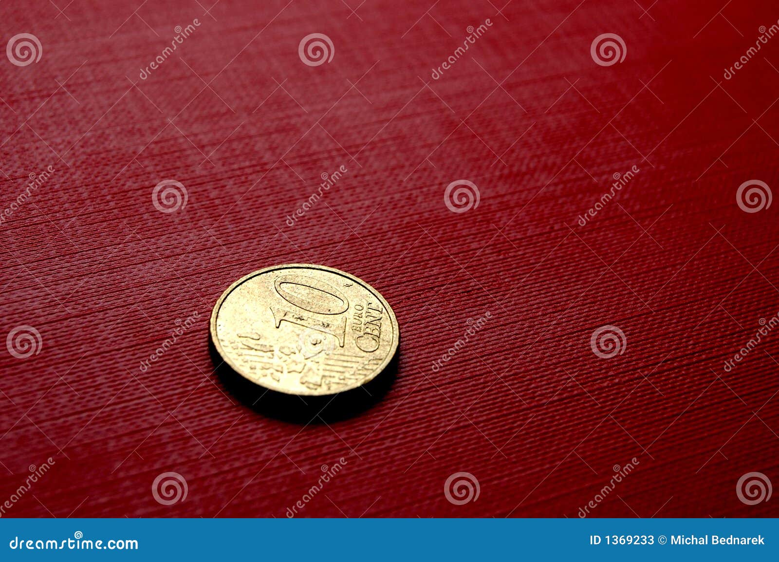 Gold coin on red surface stock image. Image of cent, savings - 1369233