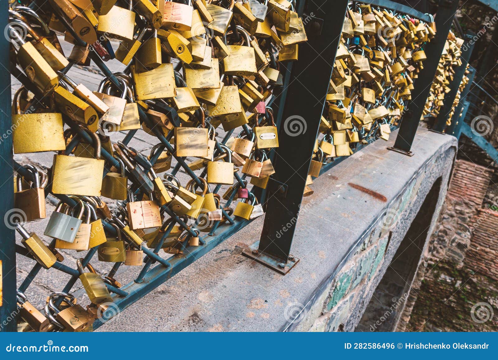 Gold Color Locks on the Bridge of Love Stock Photo - Image of padlock ...