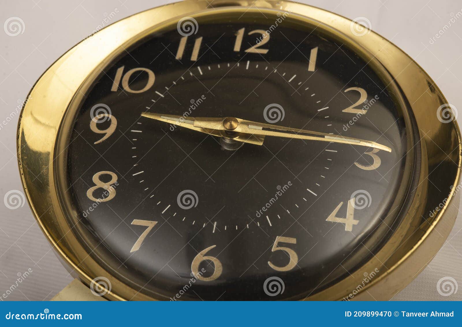 Gold Color Table Clock Showing 9 O Clock Time Closeup Stock Photo ...