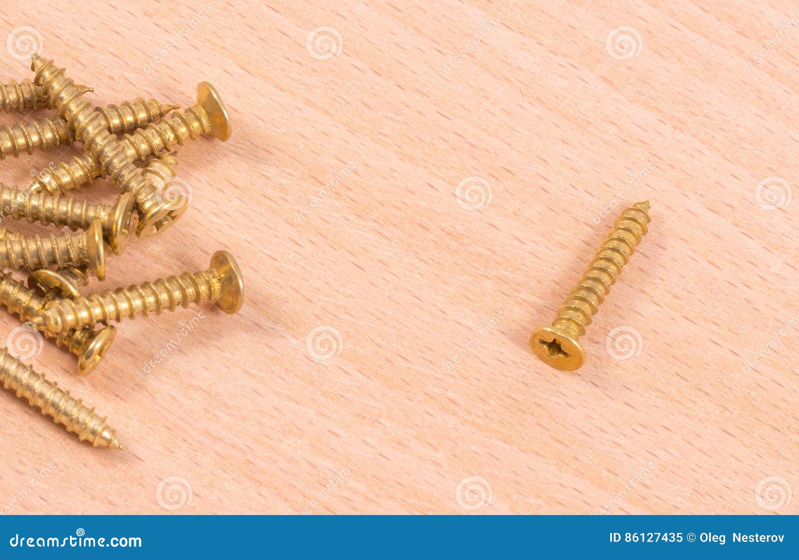 Gold-colored Screws on the Wooden Background Stock Image - Image of ...