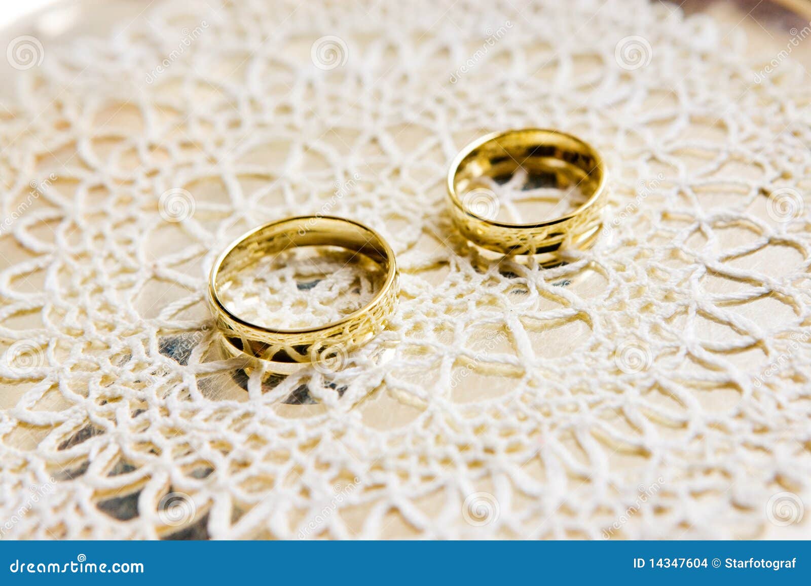 Gold-colored wedding rings stock photo. Image of togetherness - 14347604