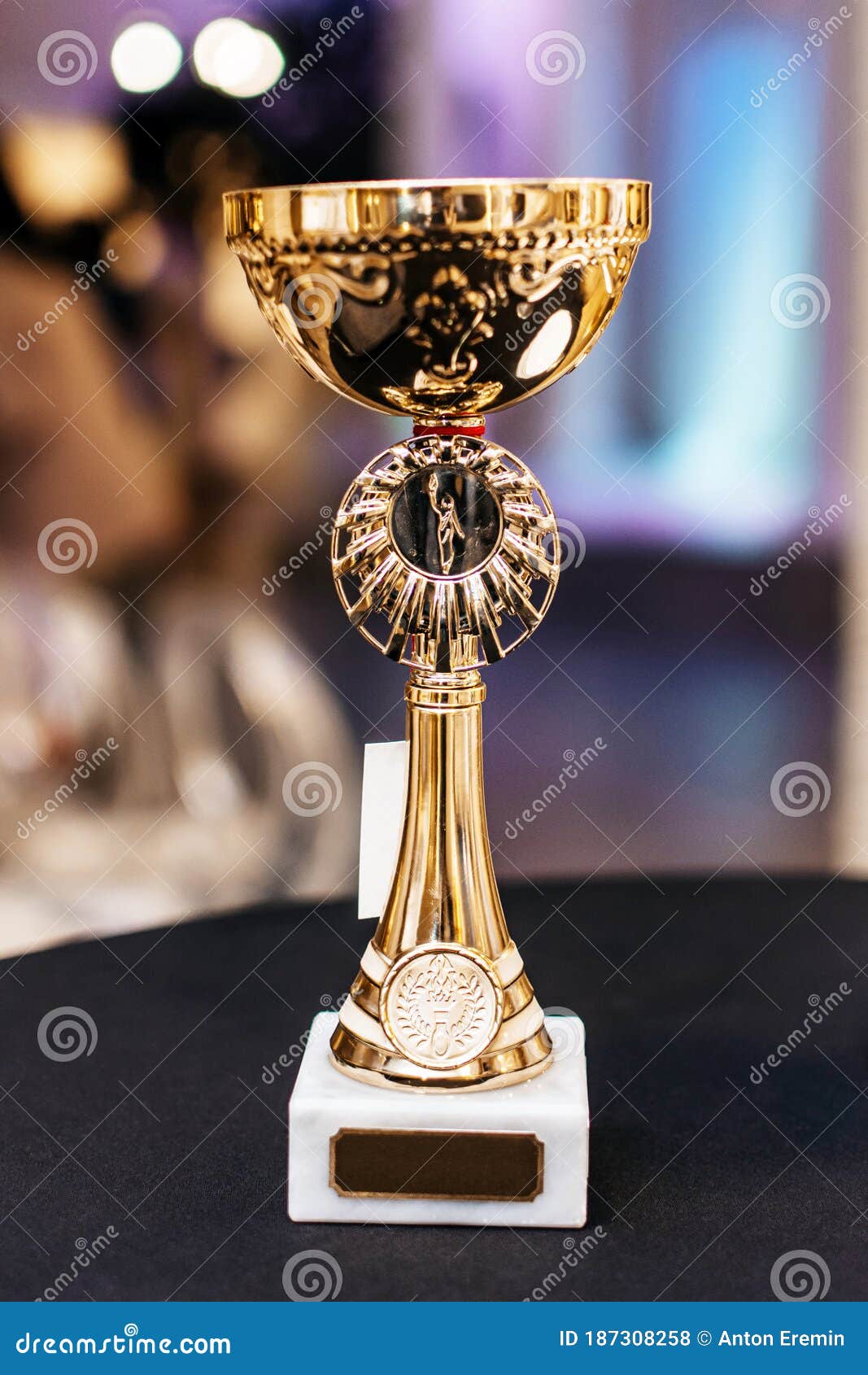 Gold Cup on a Table Vertical Stock Photo - Image of elegant, object ...