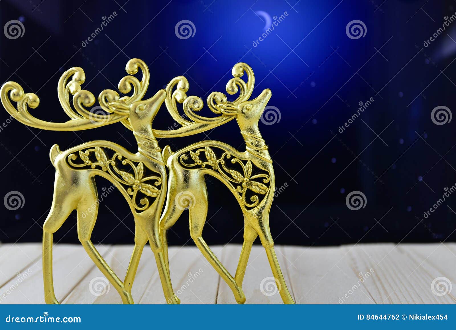 Gold Figures of Deer in the Night Sky Stock Photo - Image of festive ...