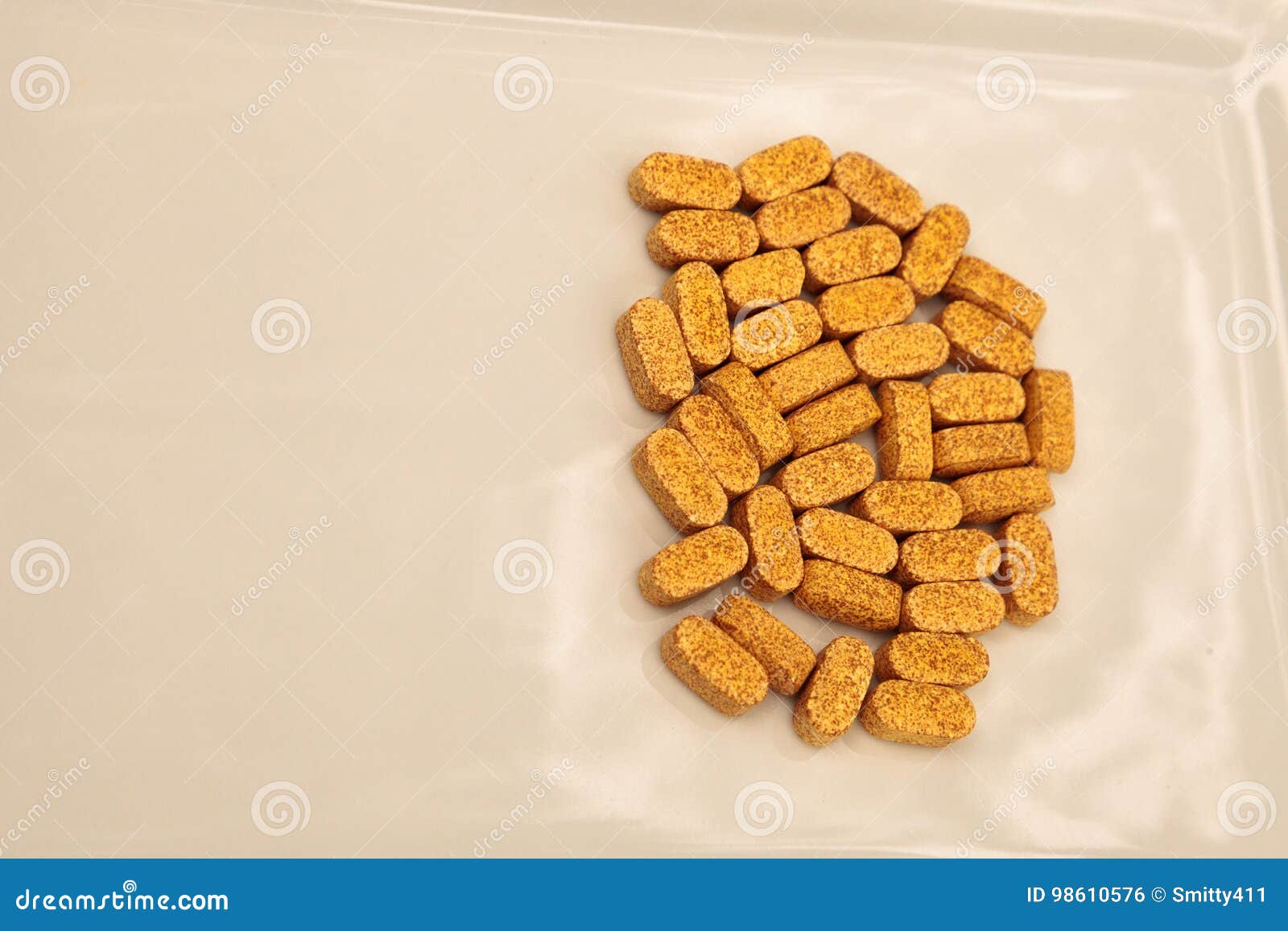 Gold Gel Capsule of Vitamin B Displayed on a White Surface. Stock Photo ...