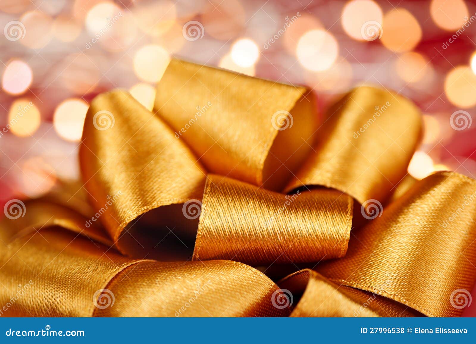 Gold Gift Bow with Festive Lights Stock Photo - Image of giftwrap ...