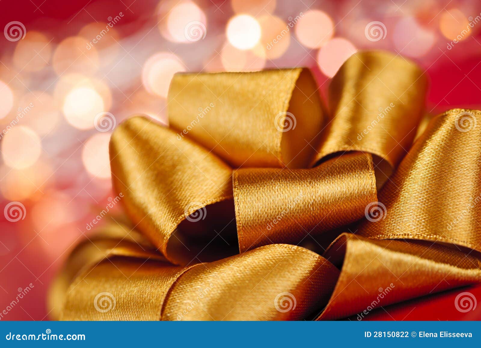 Gold Gift Bow with Festive Lights Stock Photo - Image of light, holiday ...