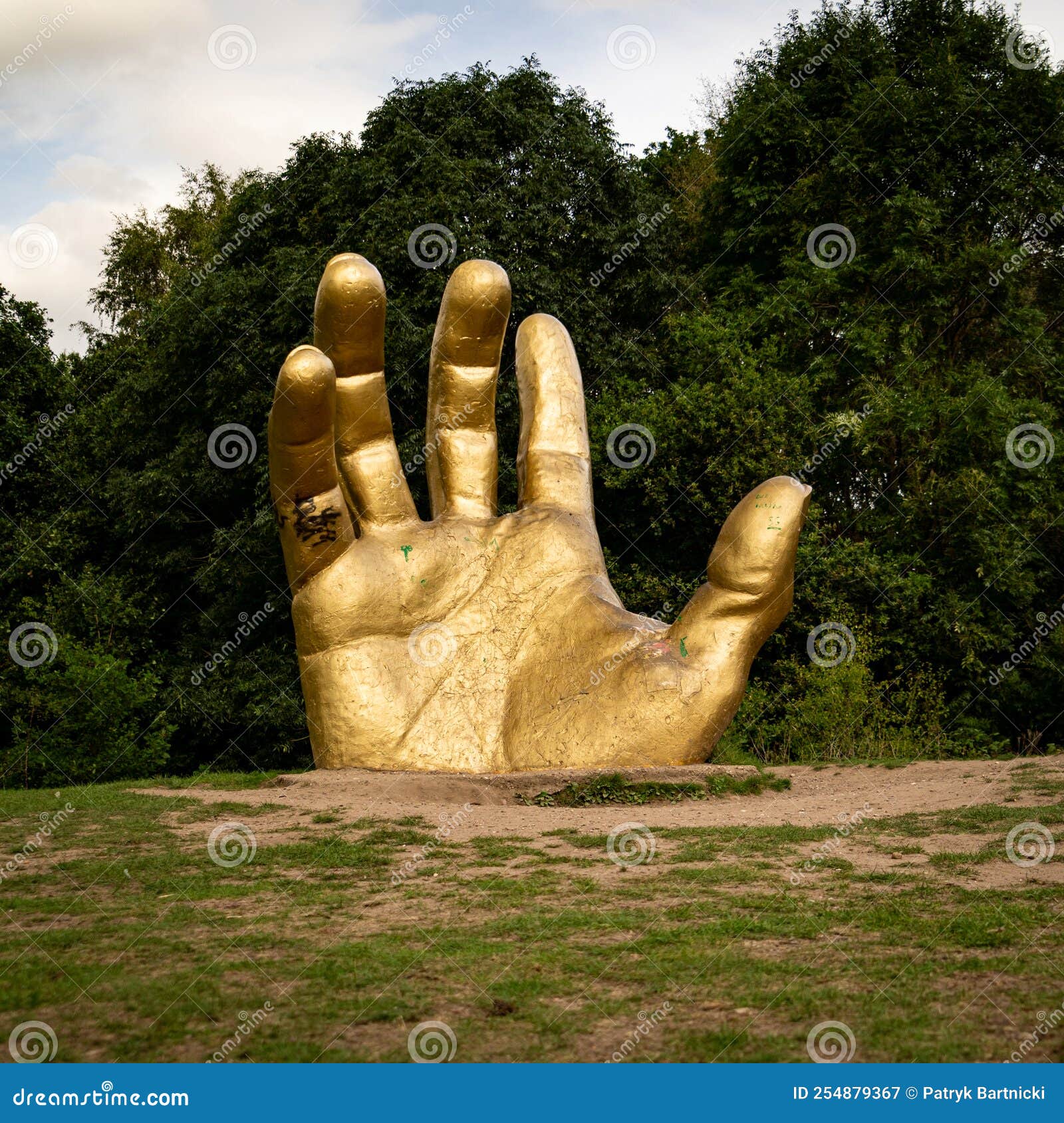 Gold Hand in Middle of Park Stock Image - Image of carving, hand: 254879367