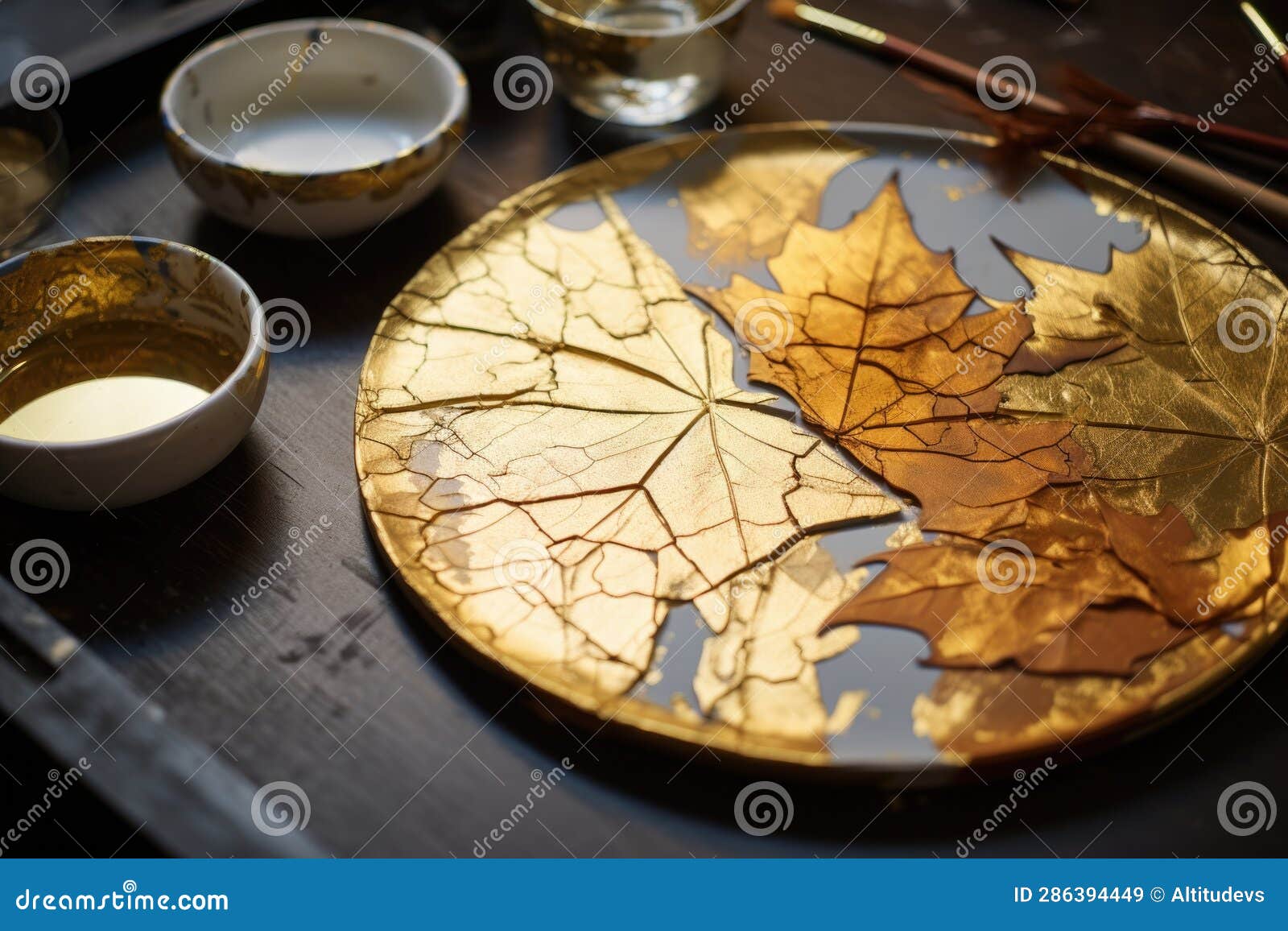 Gold-infused Kintsugi Epoxy on a Mixing Palette Stock Image - Image of ...
