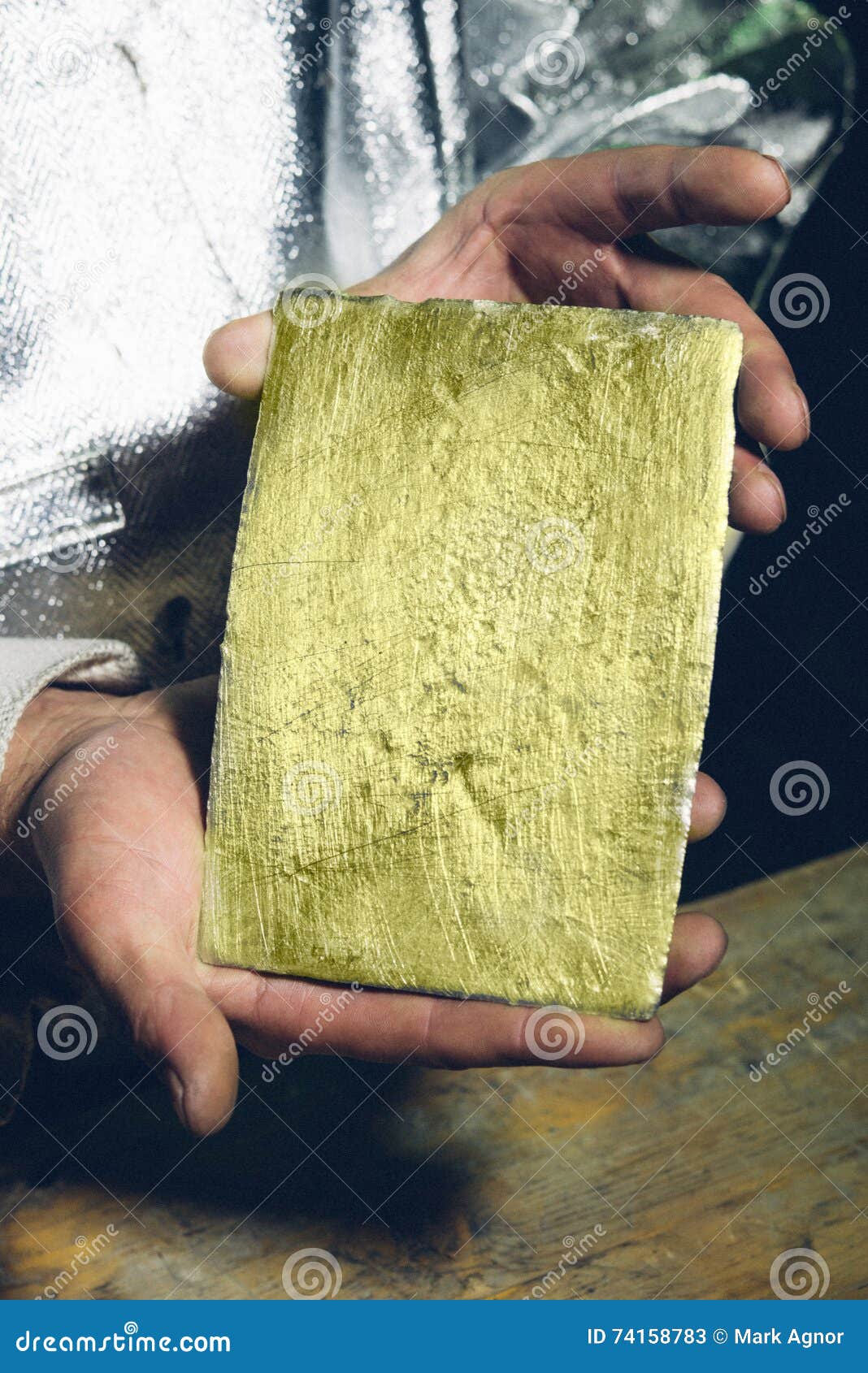 Gold ingot in hands stock image. Image of market, import - 74158783